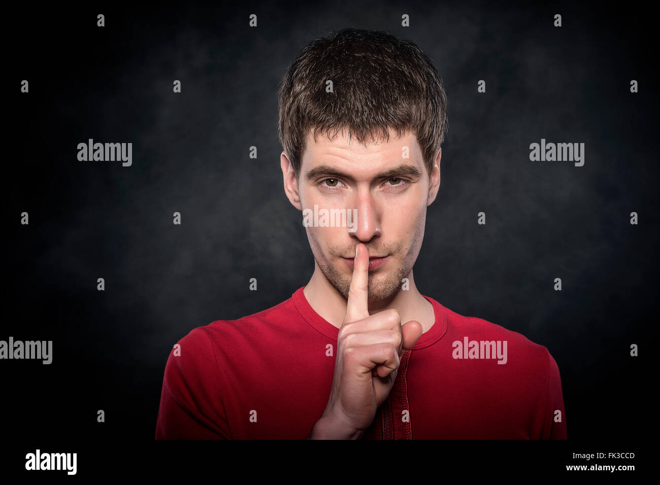 Man gesturing silence finger hi-res stock photography and images - Alamy