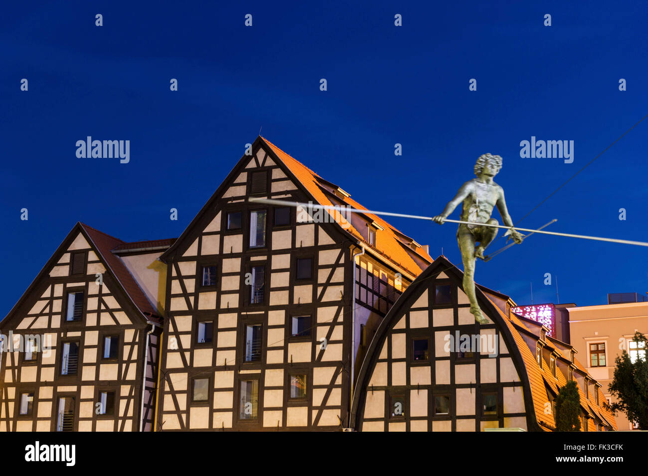 Old town view with famous statue on the rope with old Granaries in the ...