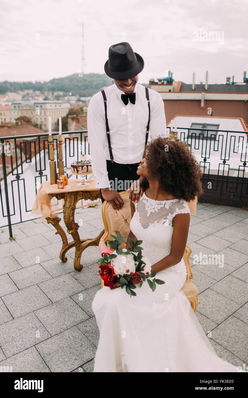 Beatuful newlyweds lovingly look at each other on the rooftop Stock ...
