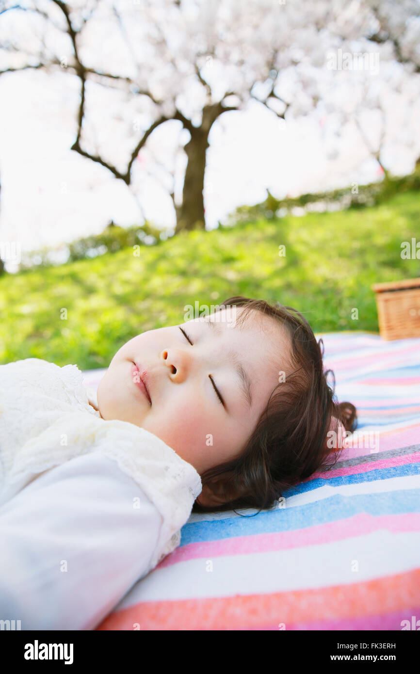 Child girl under tree sleeping hi-res stock photography and images - Alamy