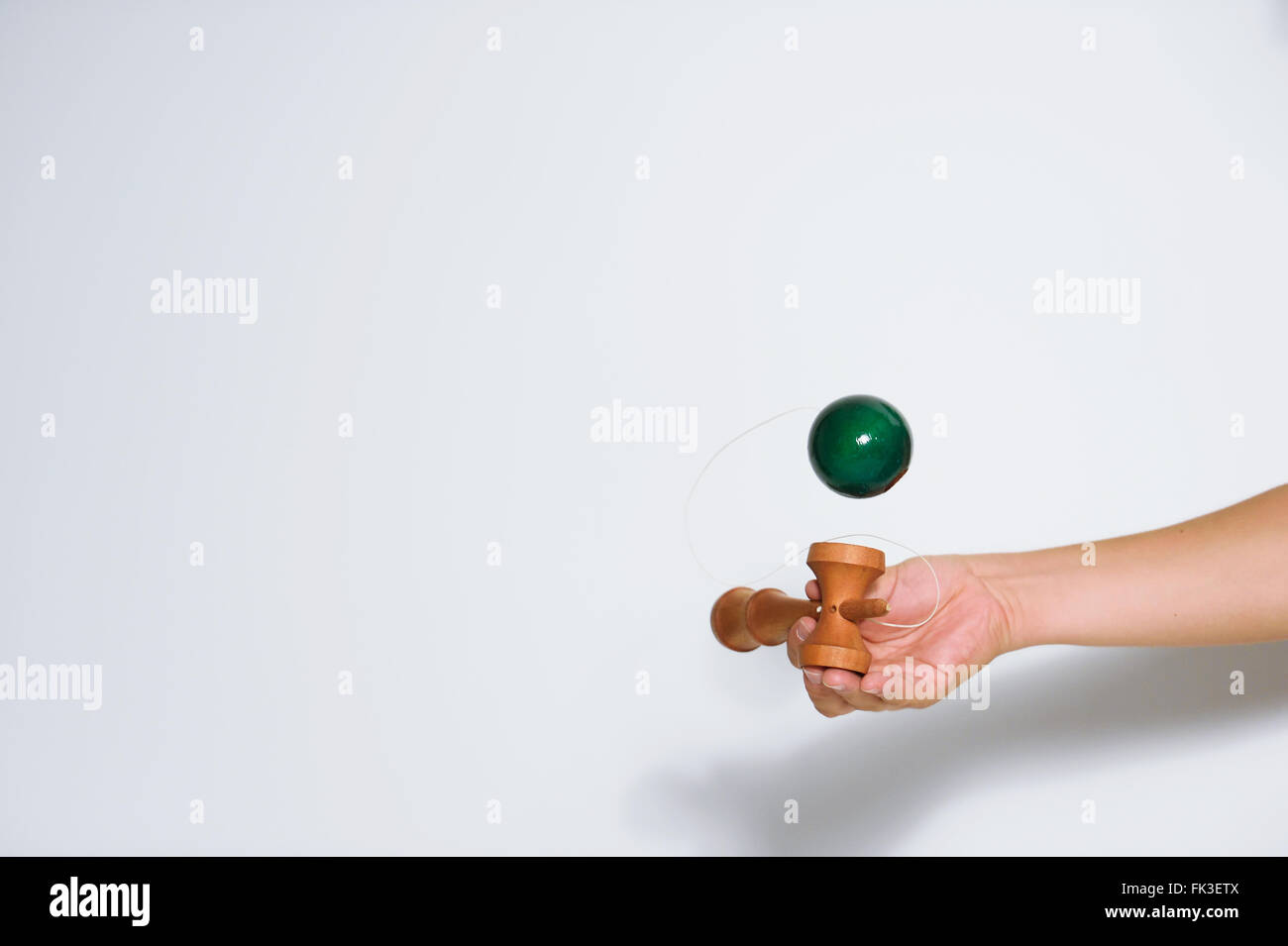 Japanese young man playing with Kendama Stock Photo - Alamy
