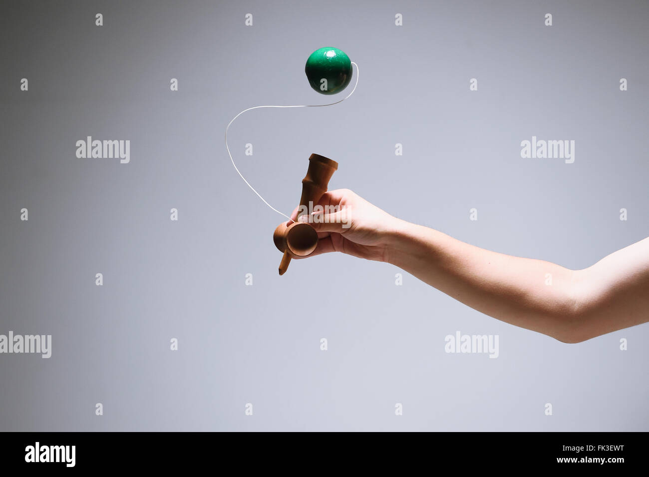 Japanese young man playing with Kendama Stock Photo - Alamy