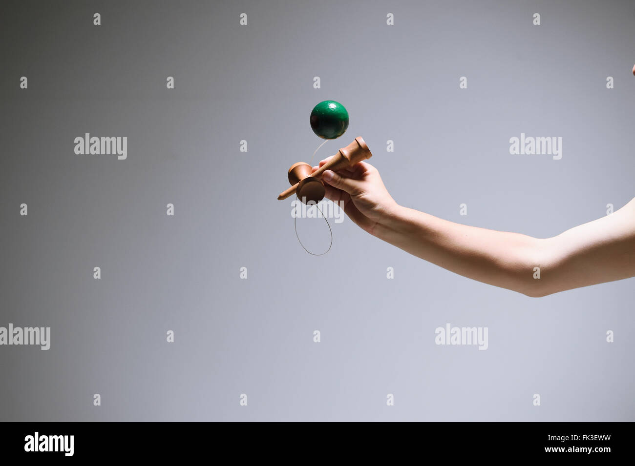 Japanese young man playing with Kendama Stock Photo - Alamy