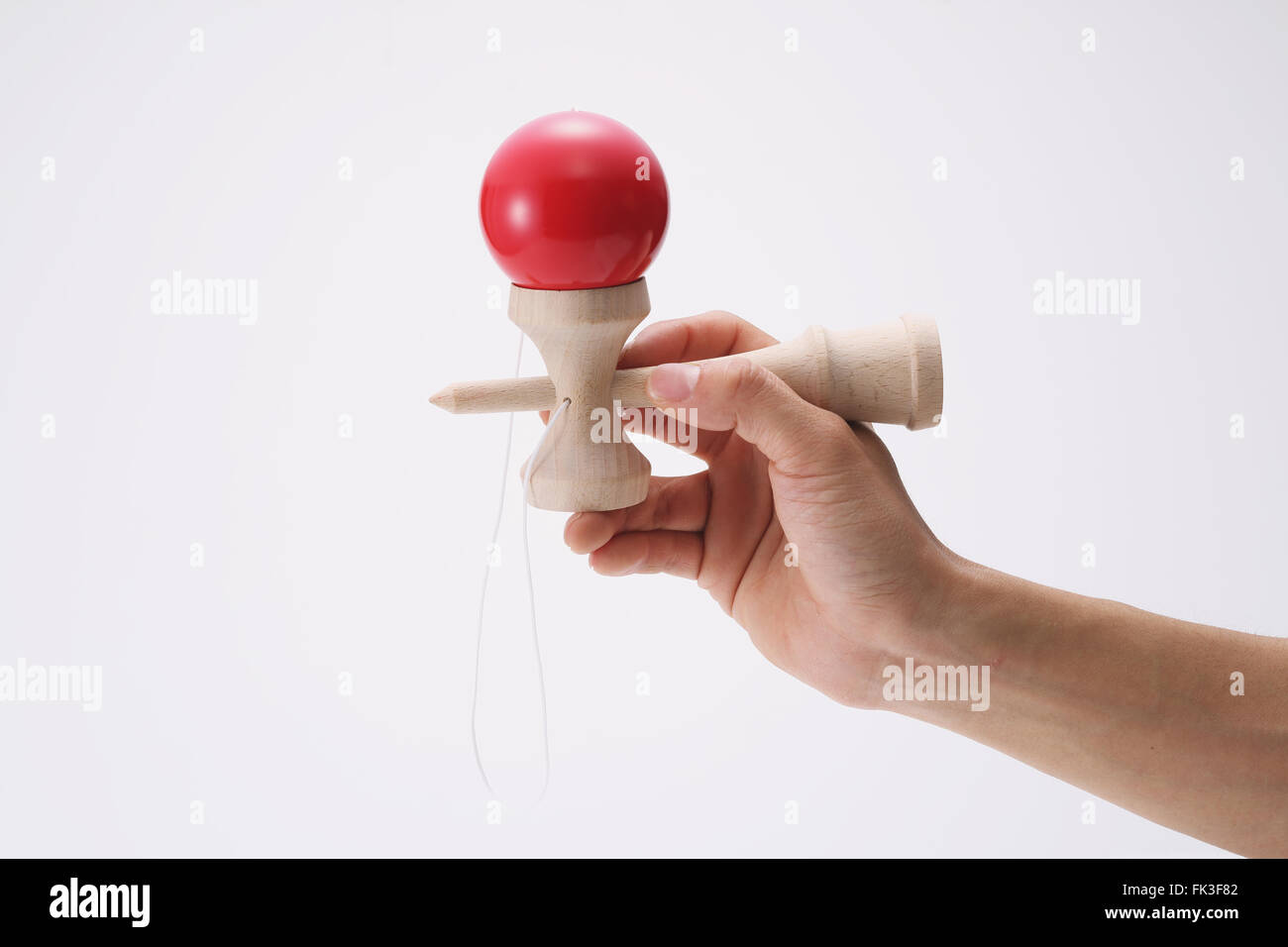 Man playing with Japanese traditional Kendama game Stock Photo - Alamy