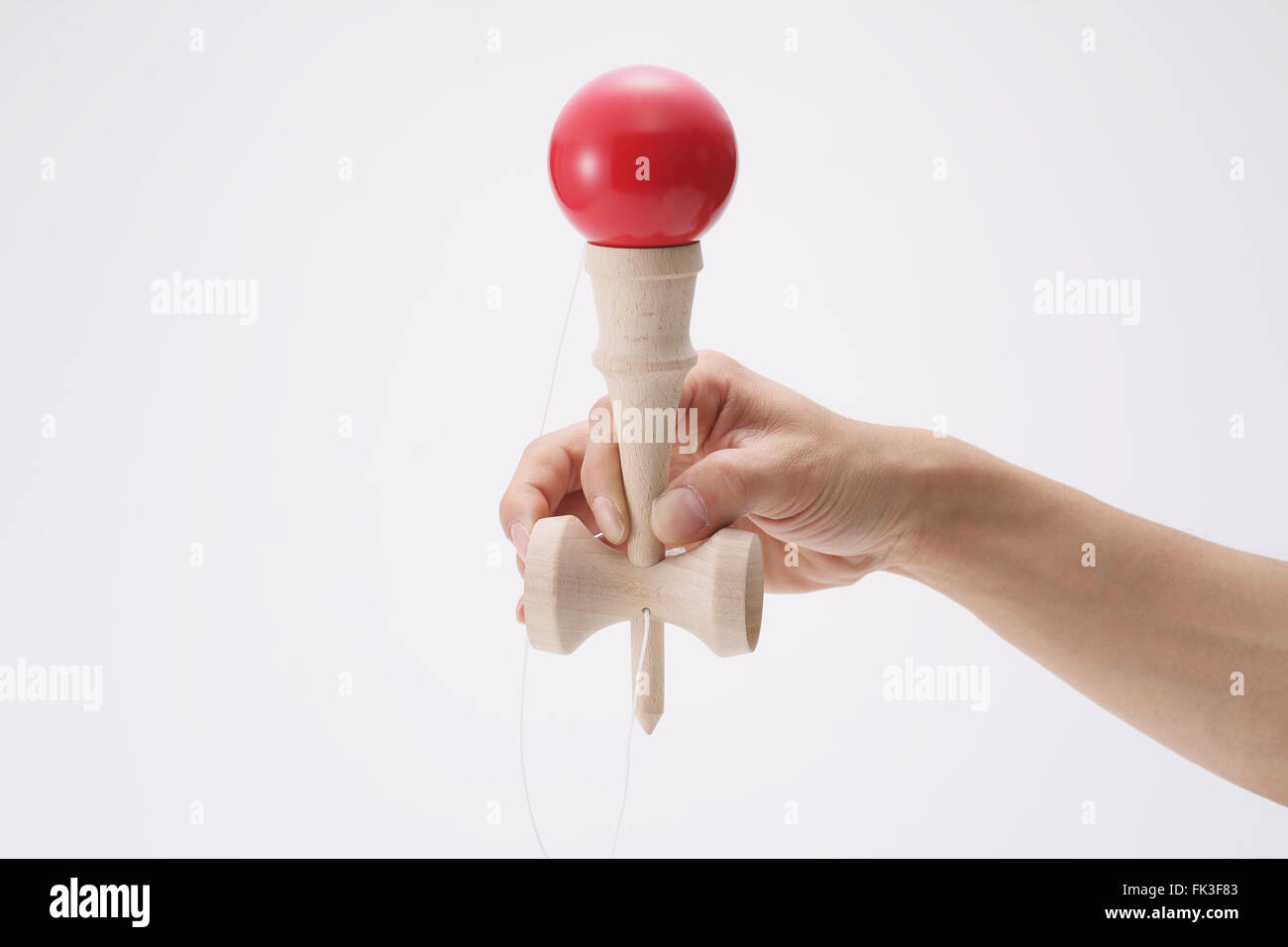 Man playing with Japanese traditional Kendama game Stock Photo - Alamy