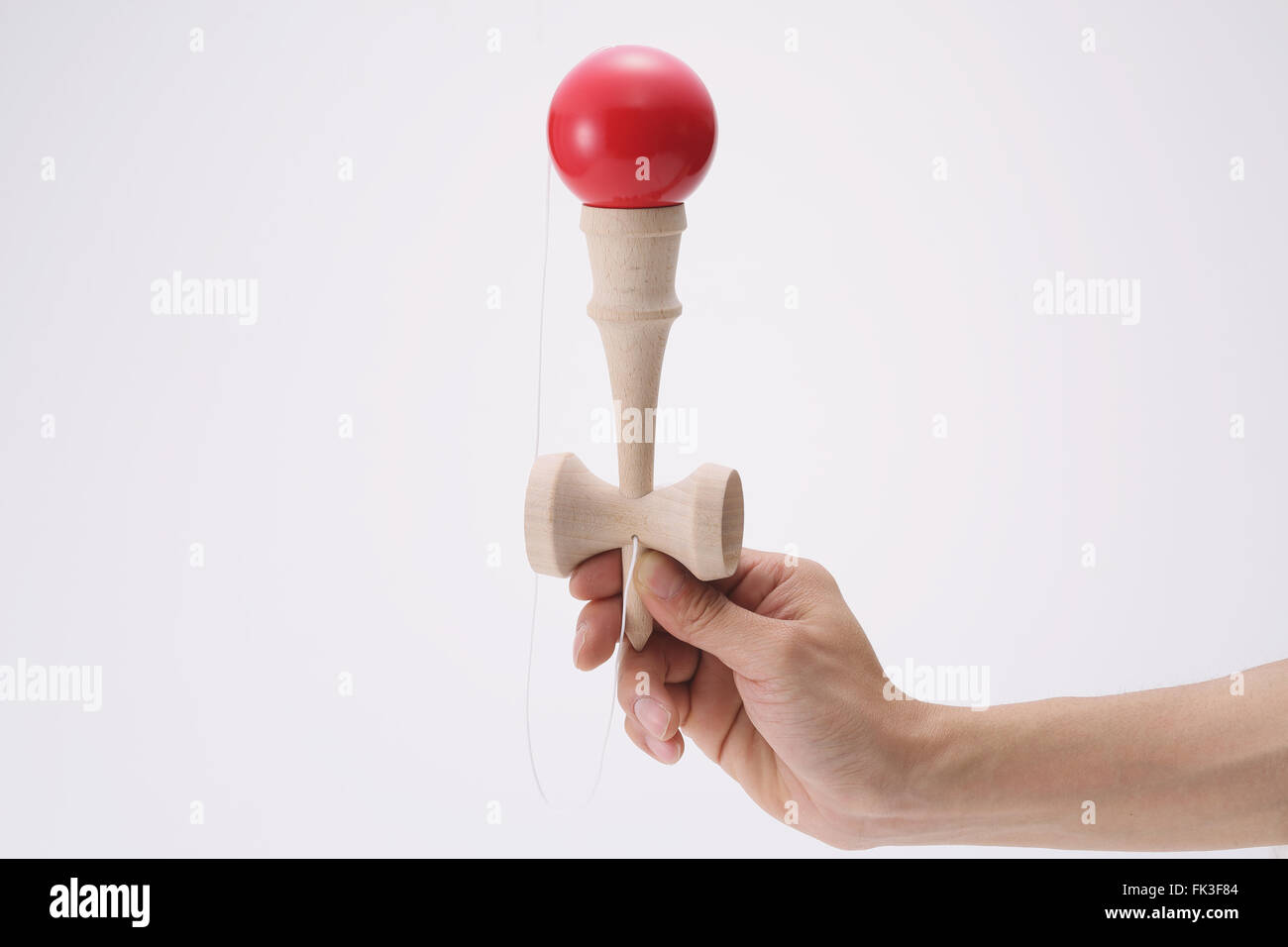 Man playing with Japanese traditional Kendama game Stock Photo - Alamy