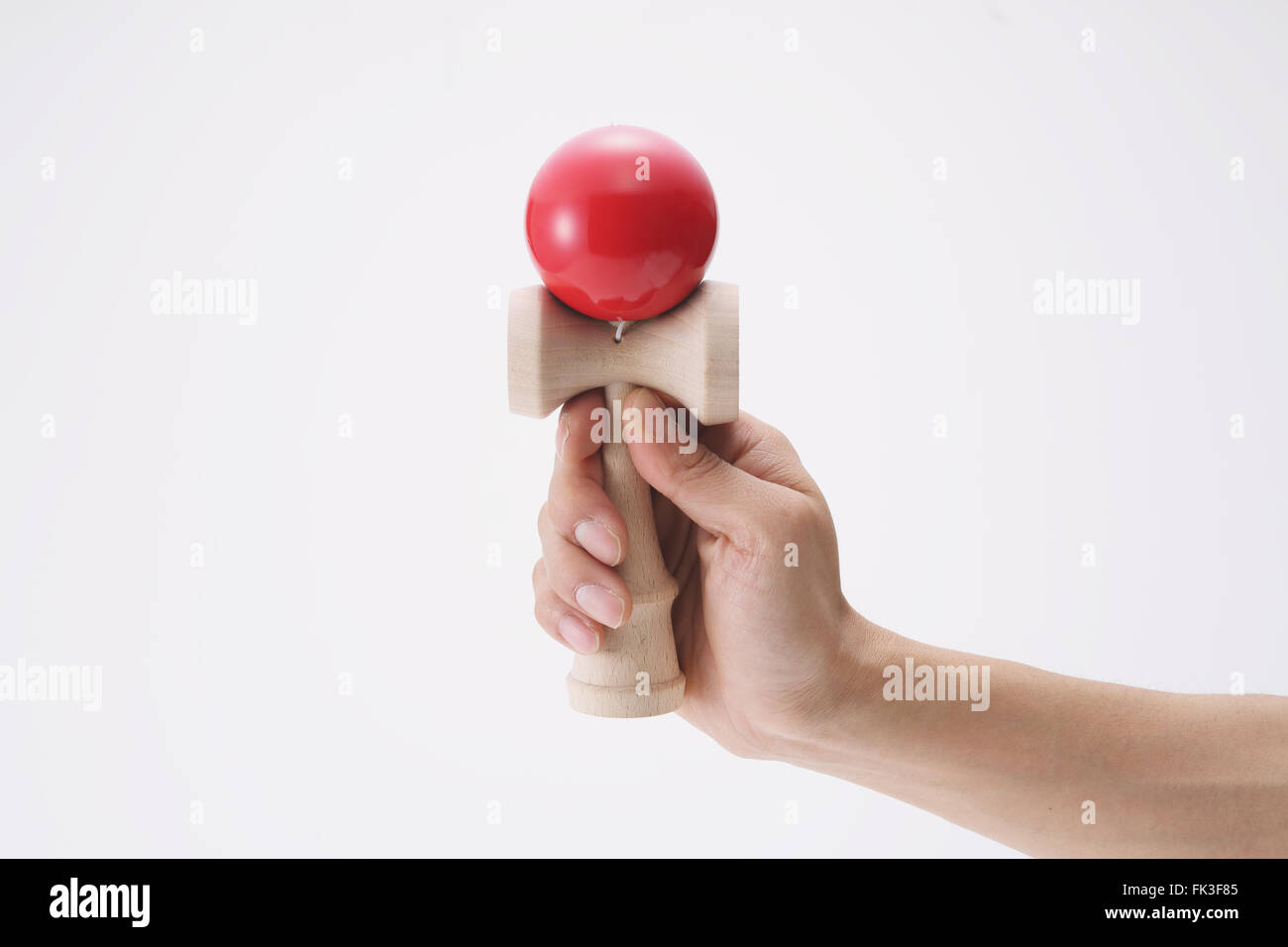 Man playing with Japanese traditional Kendama game Stock Photo - Alamy