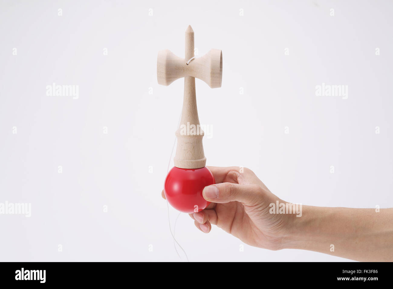 Man playing with Japanese traditional Kendama game Stock Photo - Alamy