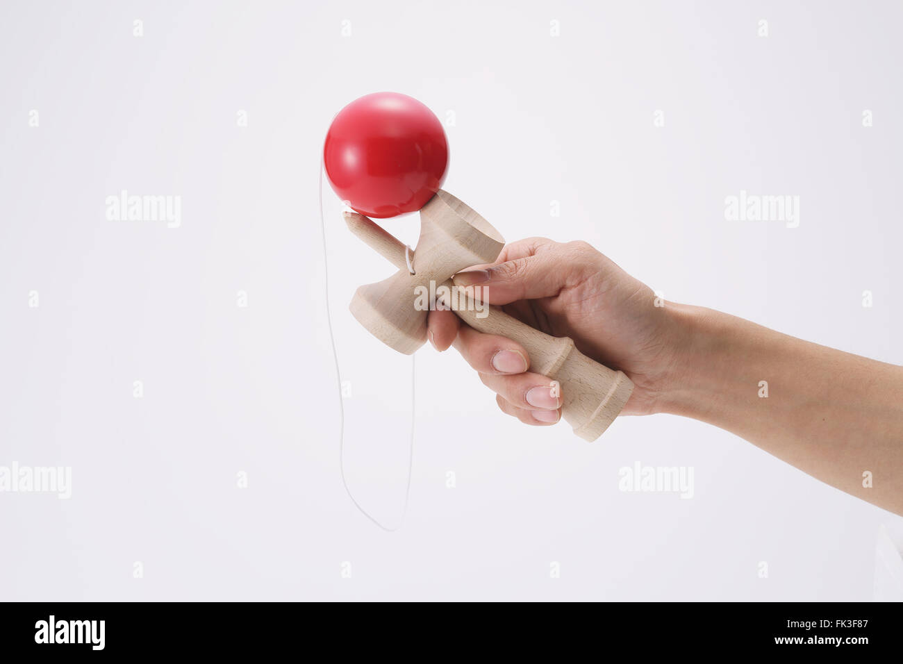 Man playing with Japanese traditional Kendama game Stock Photo - Alamy