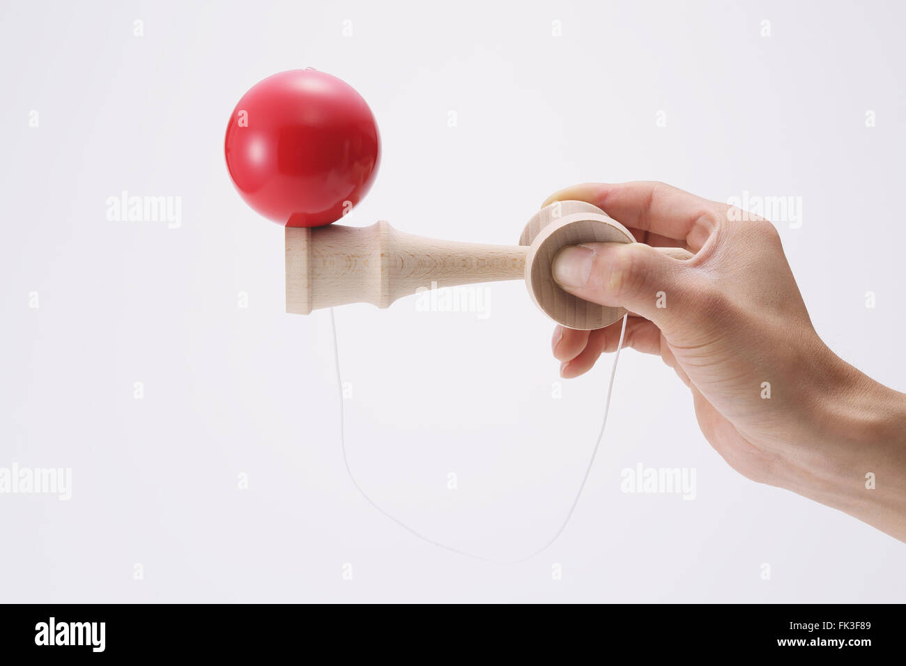 Man playing with Japanese traditional Kendama game Stock Photo - Alamy