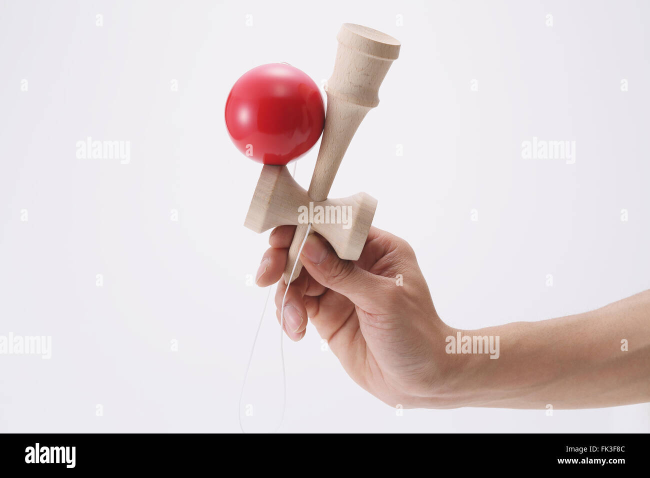 Man playing with Japanese traditional Kendama game Stock Photo - Alamy
