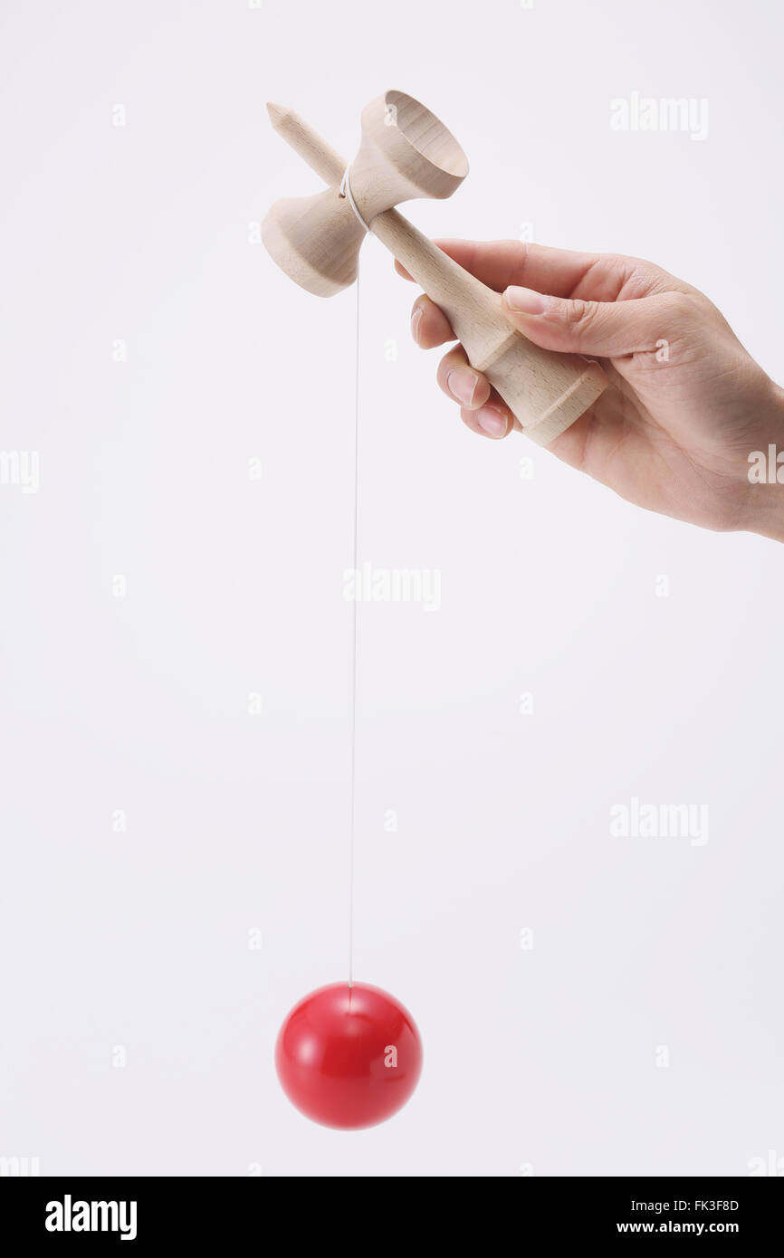 Man playing with Japanese traditional Kendama game Stock Photo - Alamy