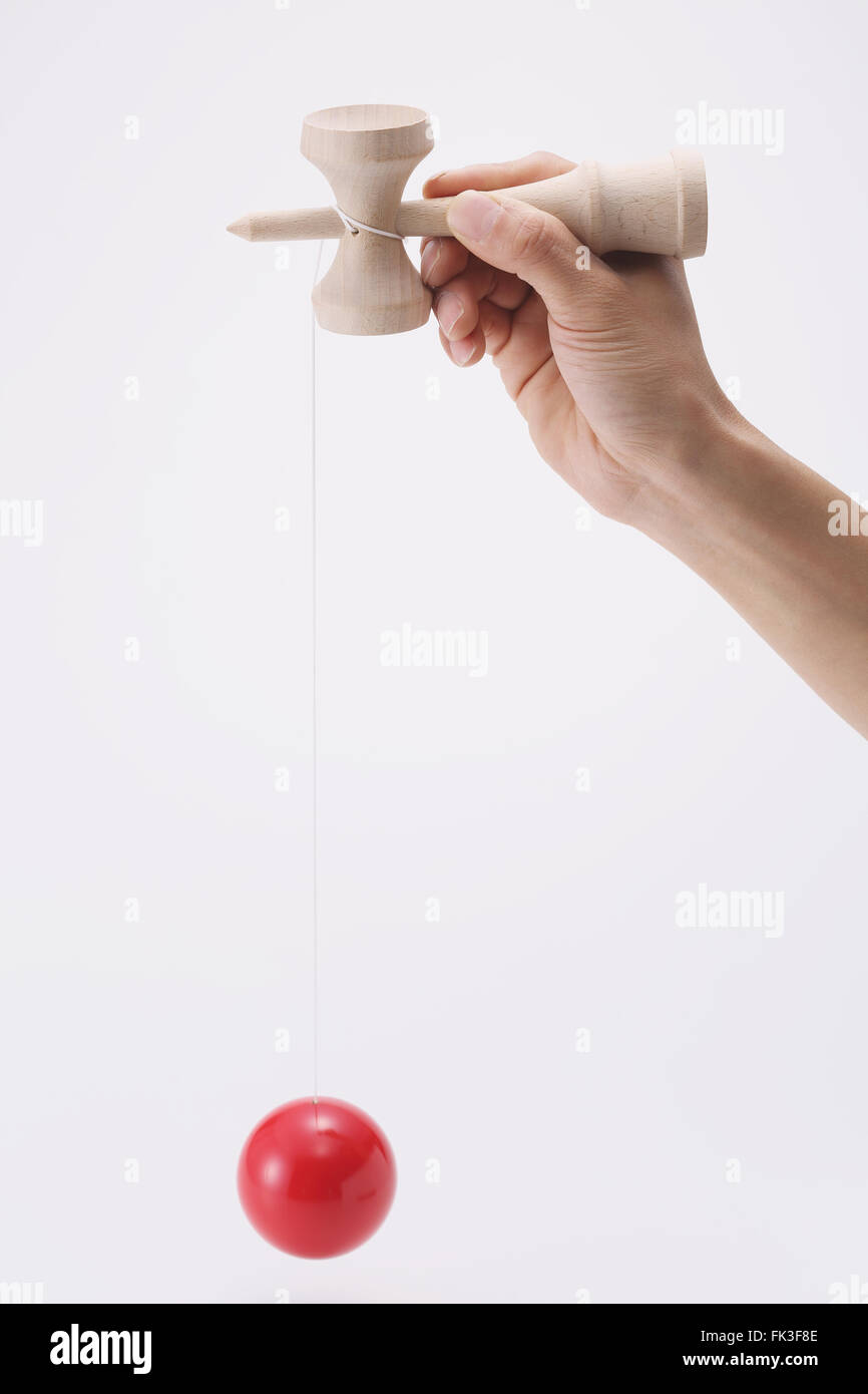 Man playing with Japanese traditional Kendama game Stock Photo - Alamy