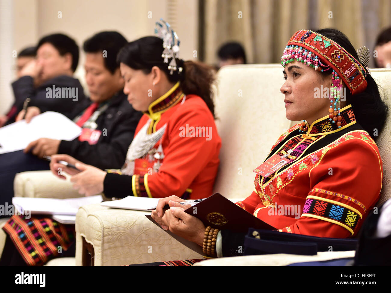 Beijing, China. 7th Mar, 2016. Lin Meijuan (1st R), a duputy to China's ...