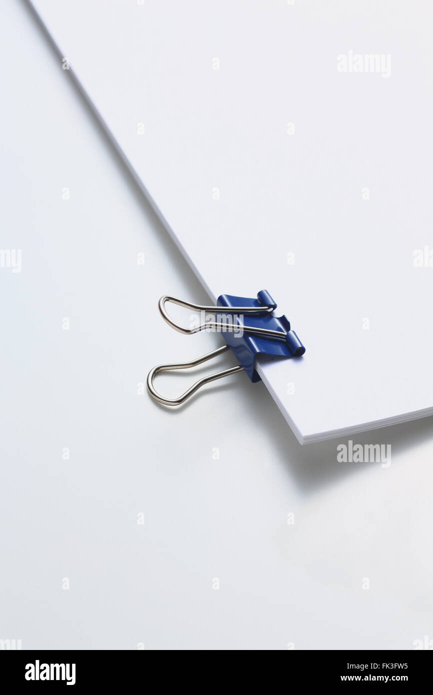 Alligator clip on paper Stock Photo - Alamy