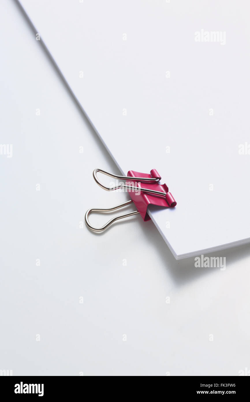 Alligator clip on paper Stock Photo - Alamy