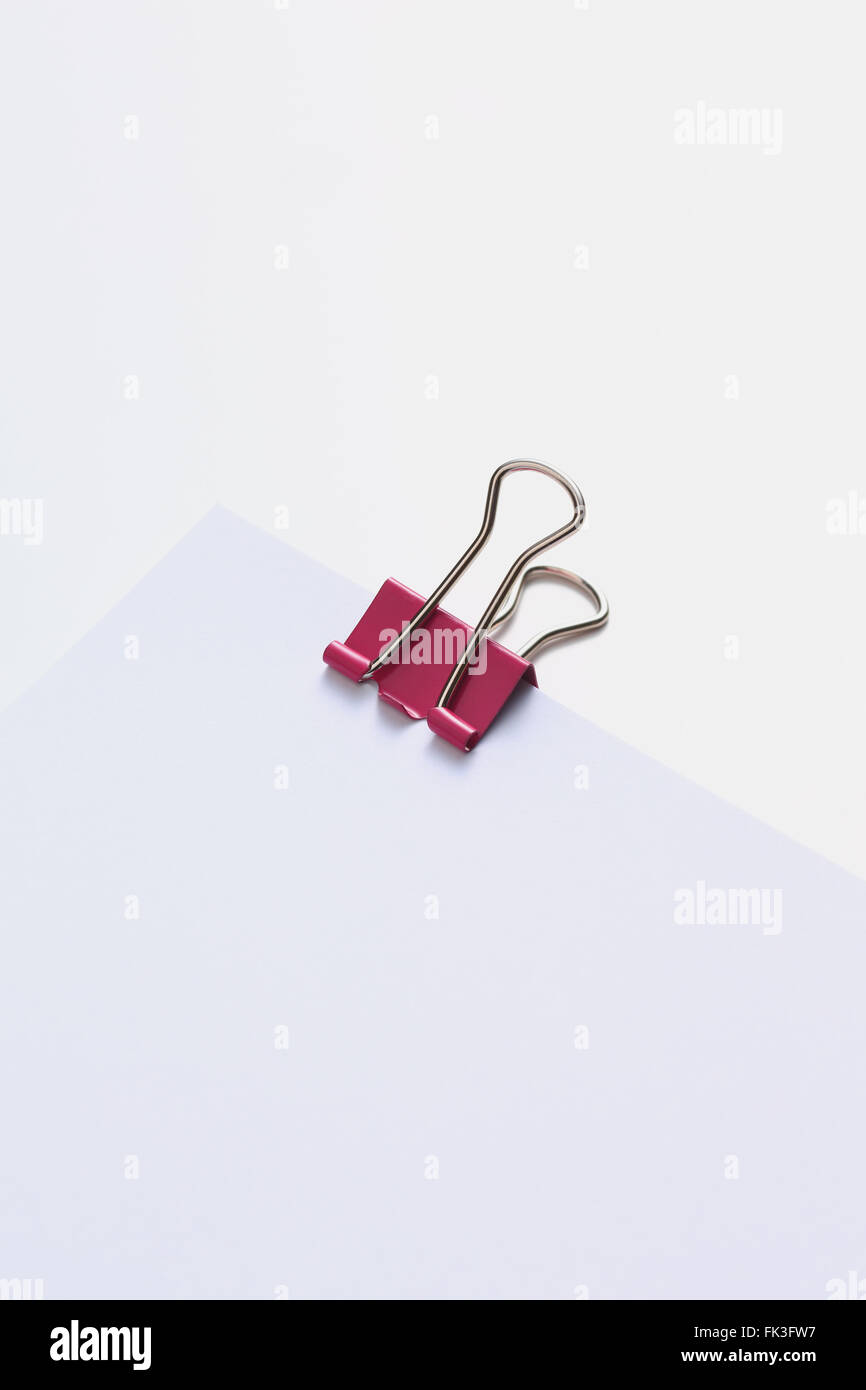 Alligator clip on paper Stock Photo - Alamy