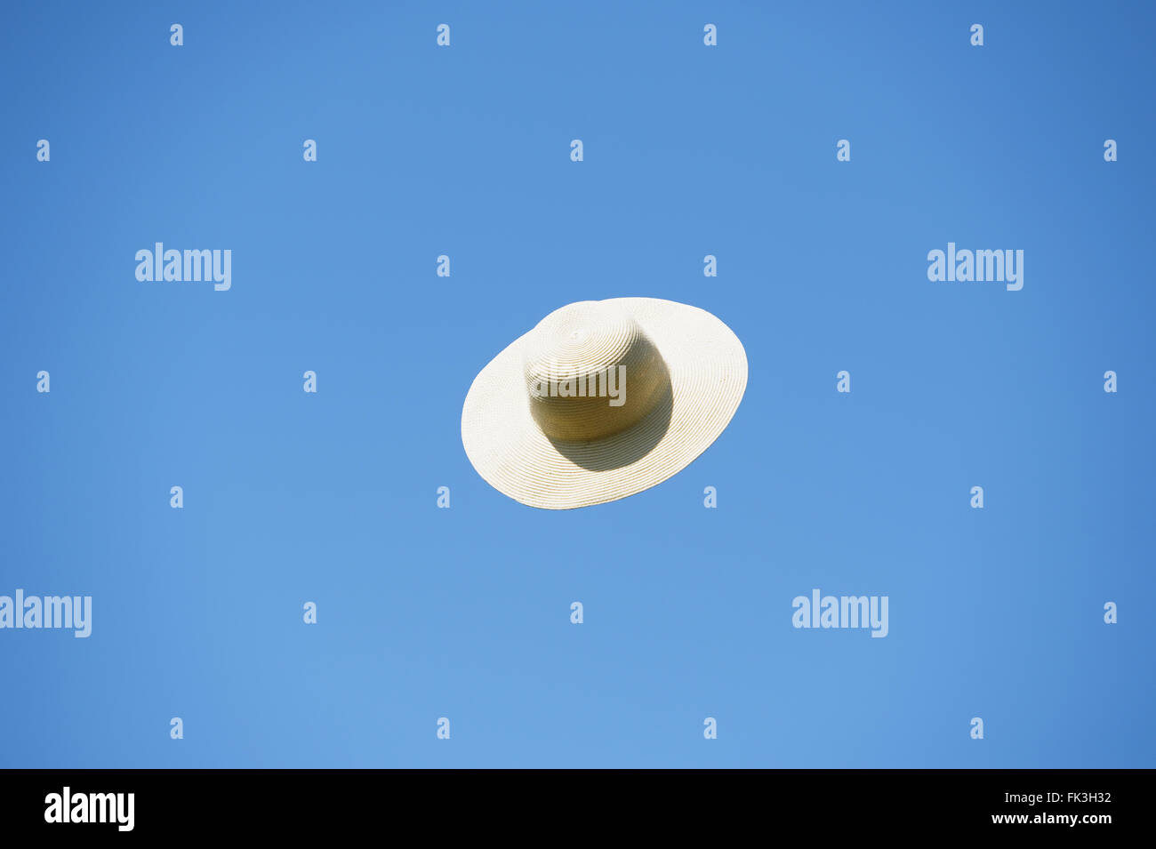 Straw hat flying in the sky Stock Photo - Alamy
