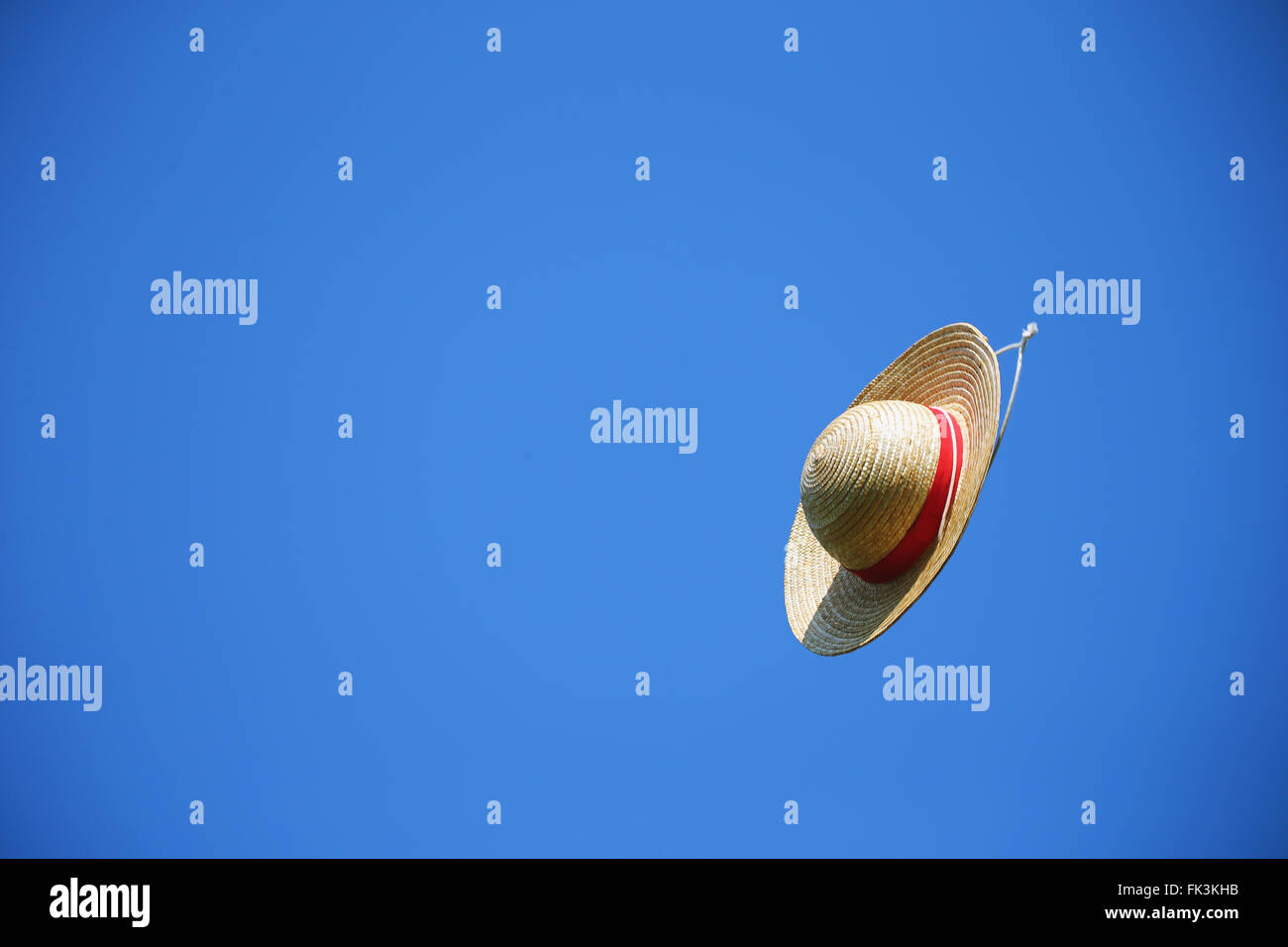 Straw hat flying in the sky Stock Photo - Alamy