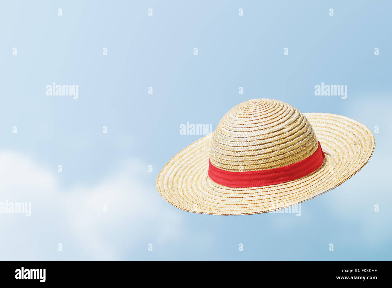 Straw hat flying in the sky Stock Photo - Alamy