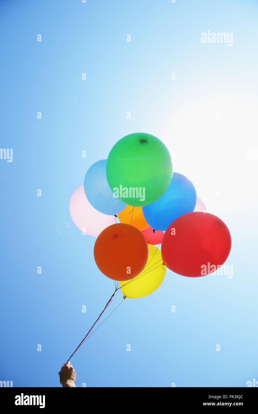 Balloon sky hands hi-res stock photography and images - Alamy