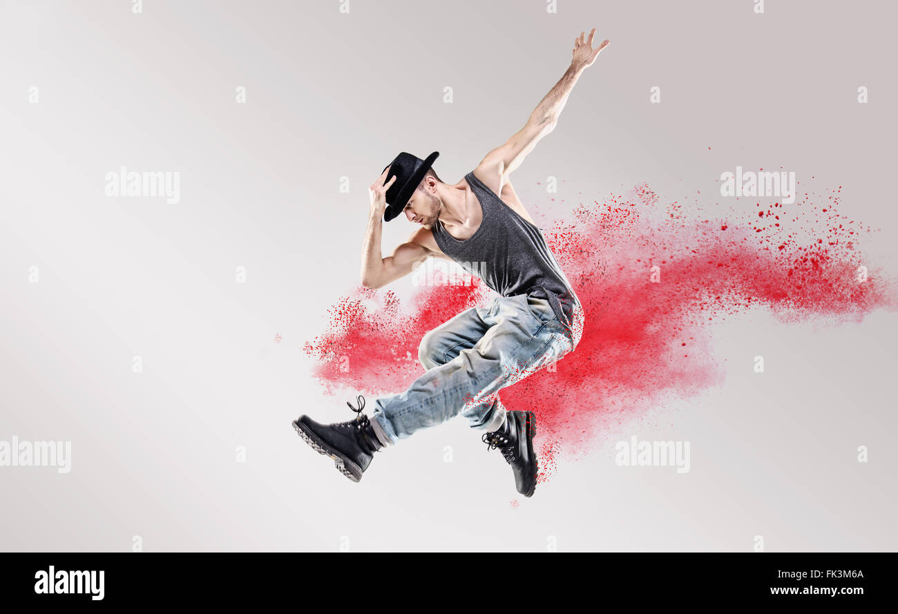 Conceptual picture of hip hop dancer among red powder Stock Photo - Alamy