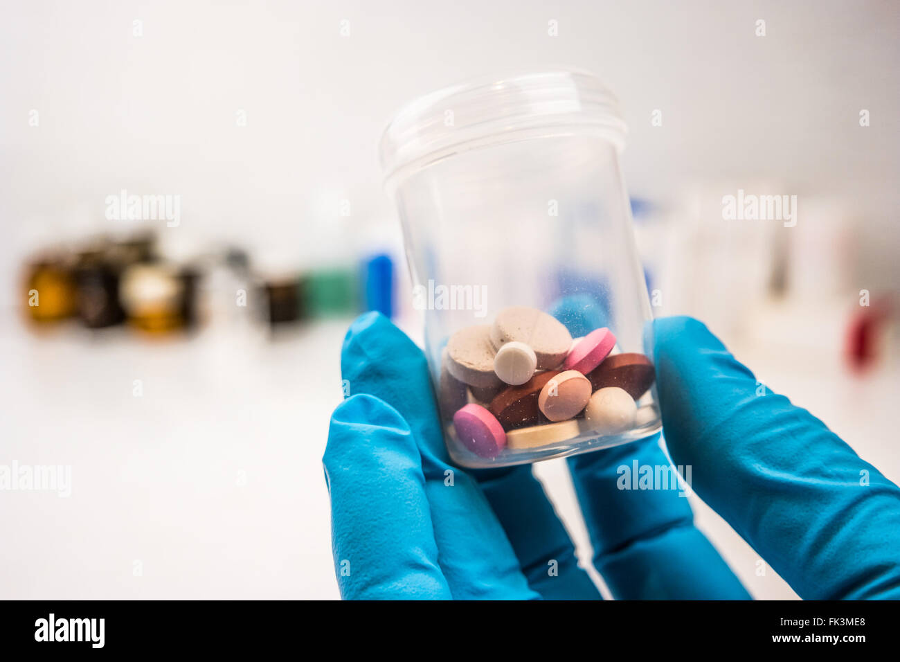 Drugs in a measuring cylinder Stock Photo - Alamy