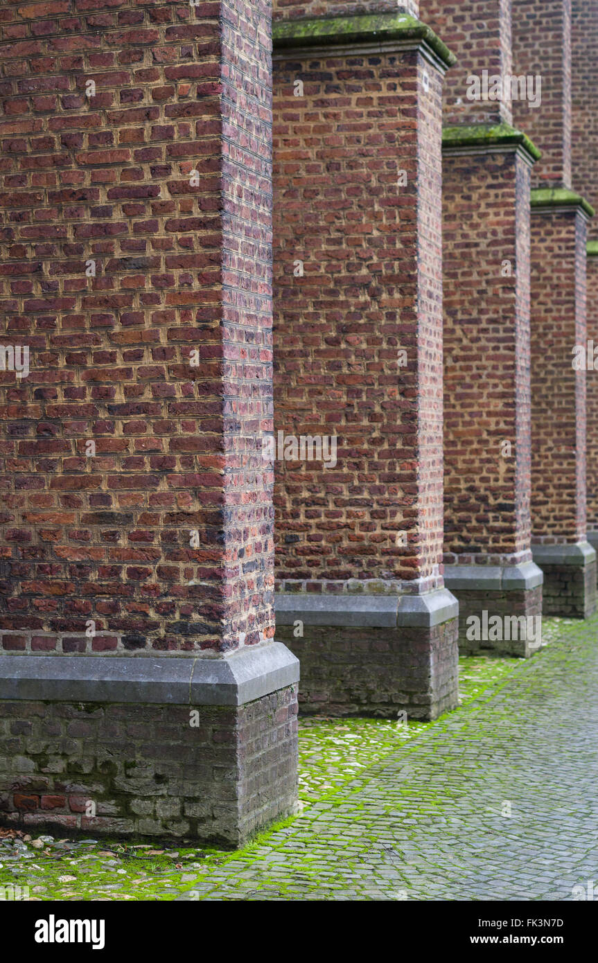 Brickwork columns in a row, abbey exterior vertical view Stock Photo ...
