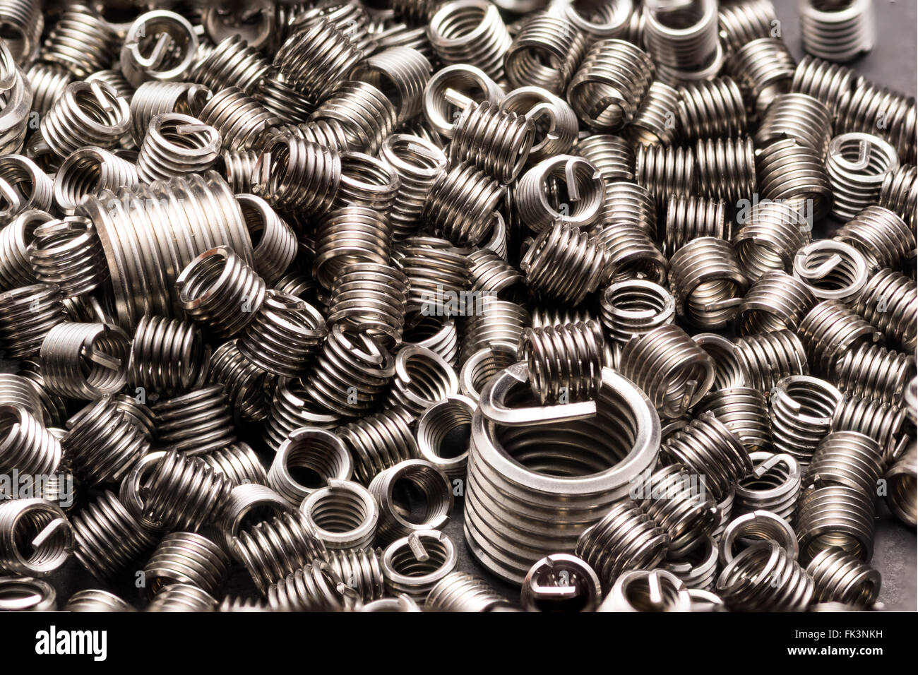 M4 and M10 helicoils, depicting industrial aplications. High resolution ...