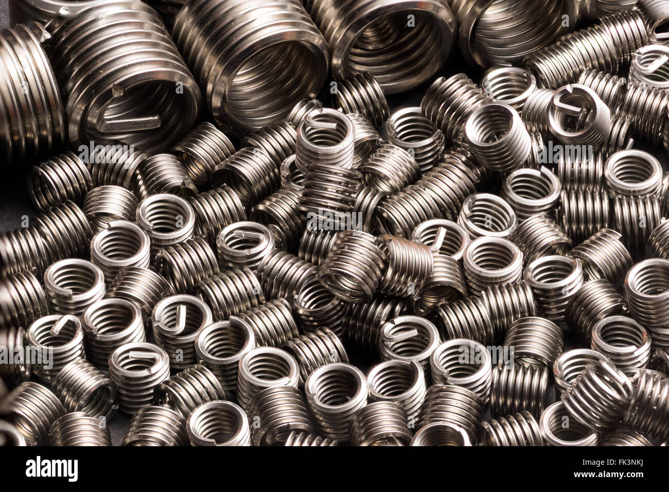 M4 and M10 helicoils, depicting industrial aplications. High resolution ...