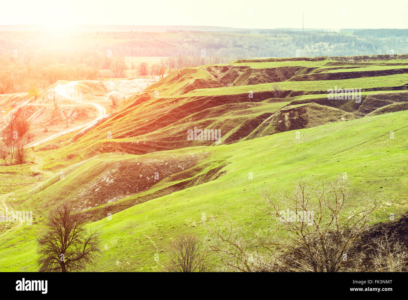 Spring nature landscape with hills, covered green grass, and tourist ...