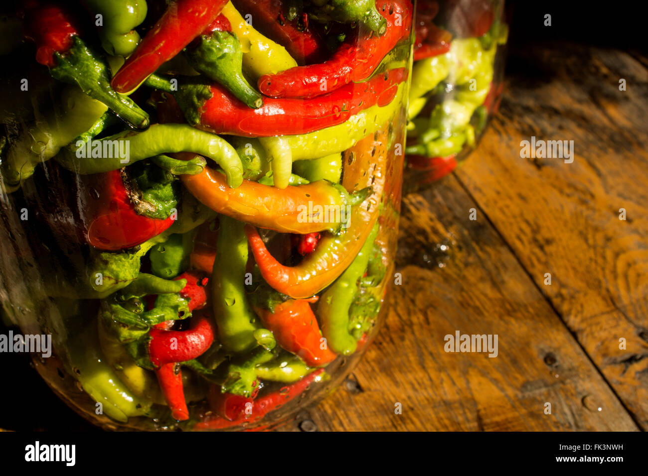 Traditional Jarred yellow, green, red, hot peppers. High resolution ...