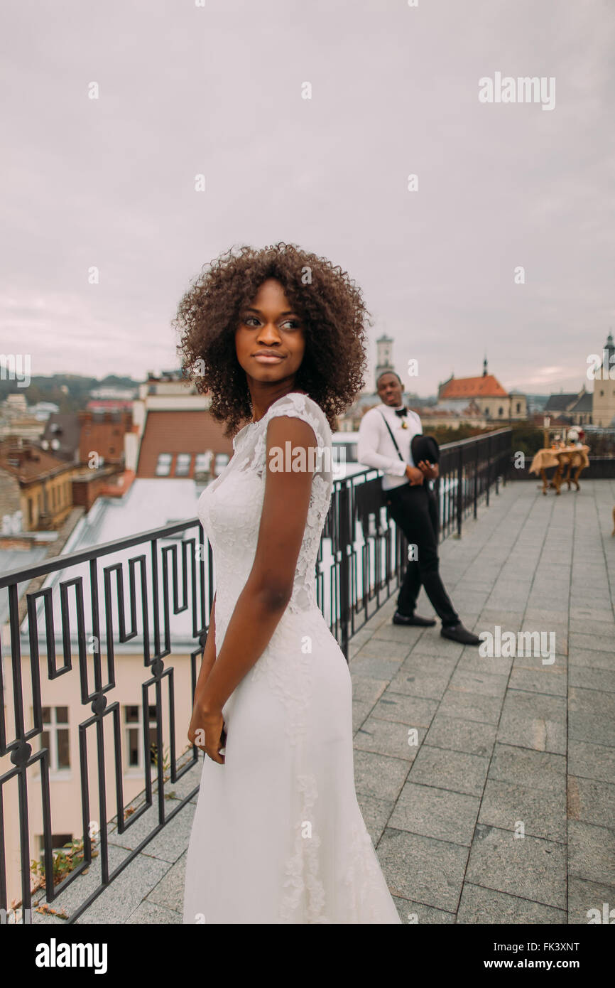 Beautiful african bride and stylish groom on background posing for ...