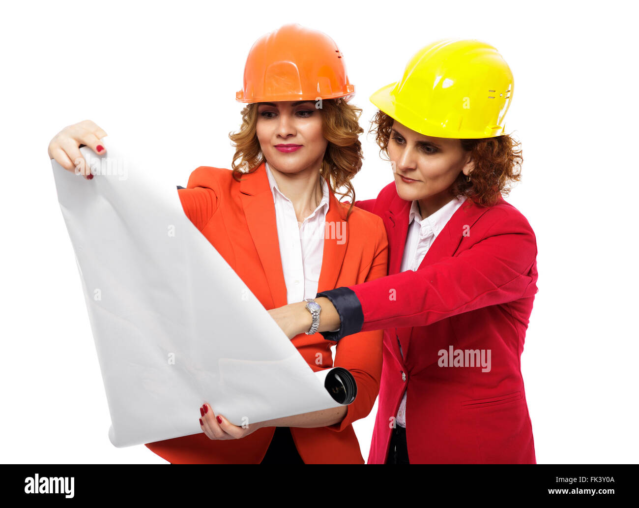 Two women engineer looking together over a big construction project ...