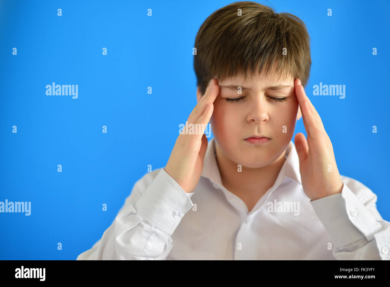 Portrait of teenage boy with a headache Stock Photo - Alamy