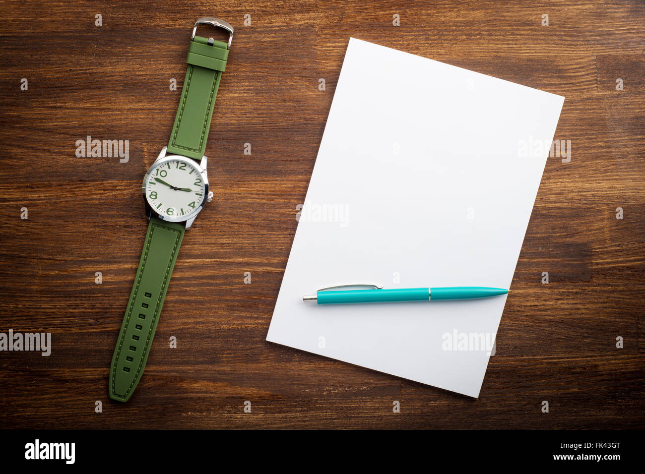 Notepad and watches on the desk Stock Photo - Alamy