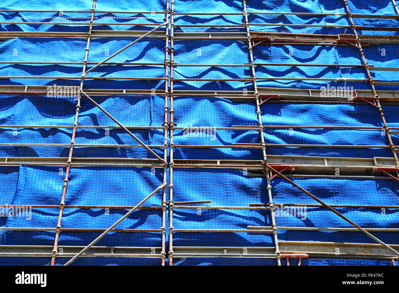 Building construction scaffolding with blue fabric Stock Photo - Alamy
