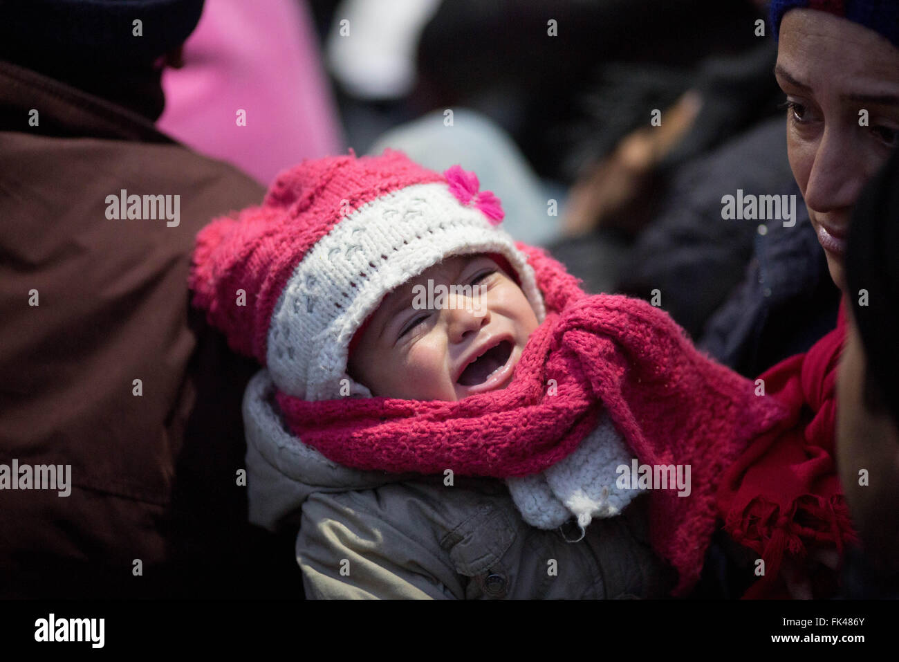 Idomeni, Greece. 07th Mar, 2016. A refugee baby cries in the waiting ...