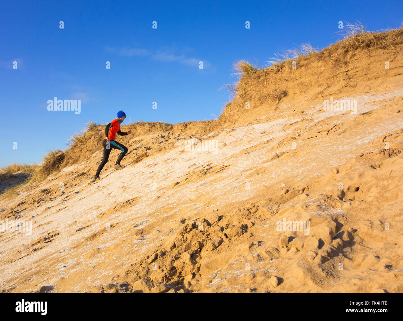 Athlete running on sand dunes hi-res stock photography and images - Alamy