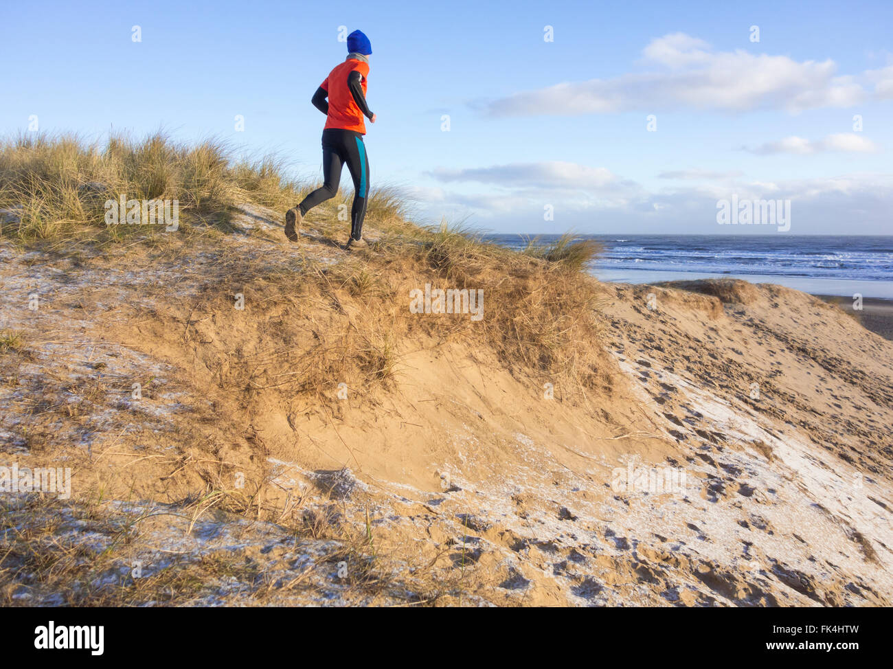 Athlete running on sand dunes hi-res stock photography and images - Alamy