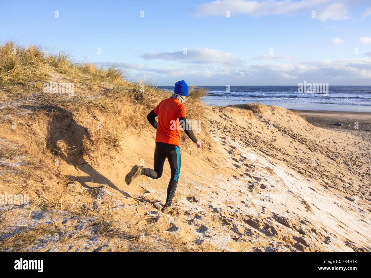 Athlete running on sand dunes hi-res stock photography and images - Alamy