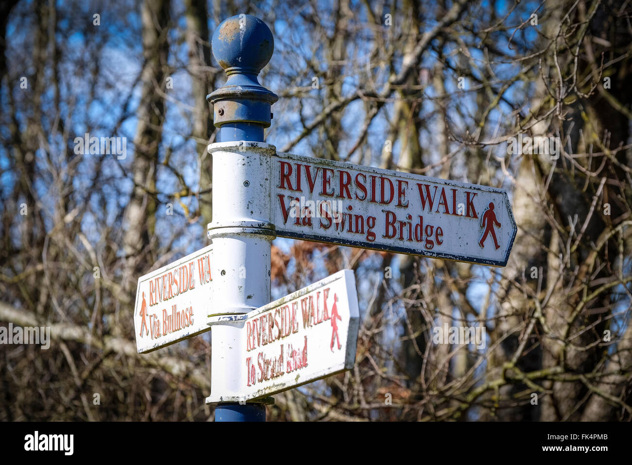 Signpost giving walking route directions Stock Photo - Alamy