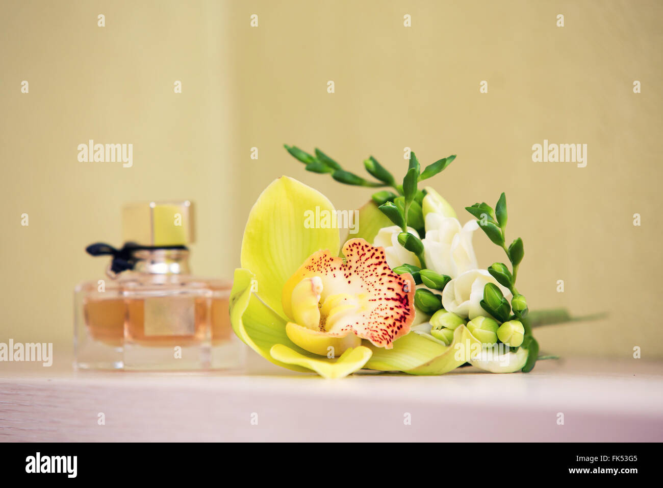 bud of an orchid of green color and woman's perfume Stock Photo - Alamy