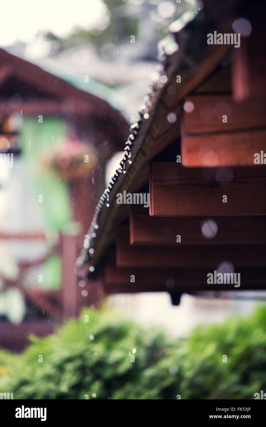 rain drops on a roof of the wooden house Stock Photo - Alamy