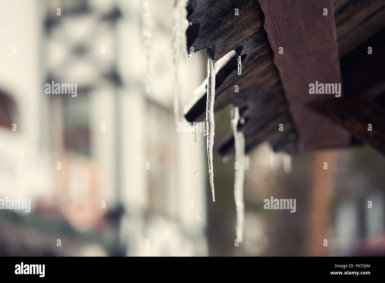 Icicles hanging on roof at winter. Natural ice formation of ice ...