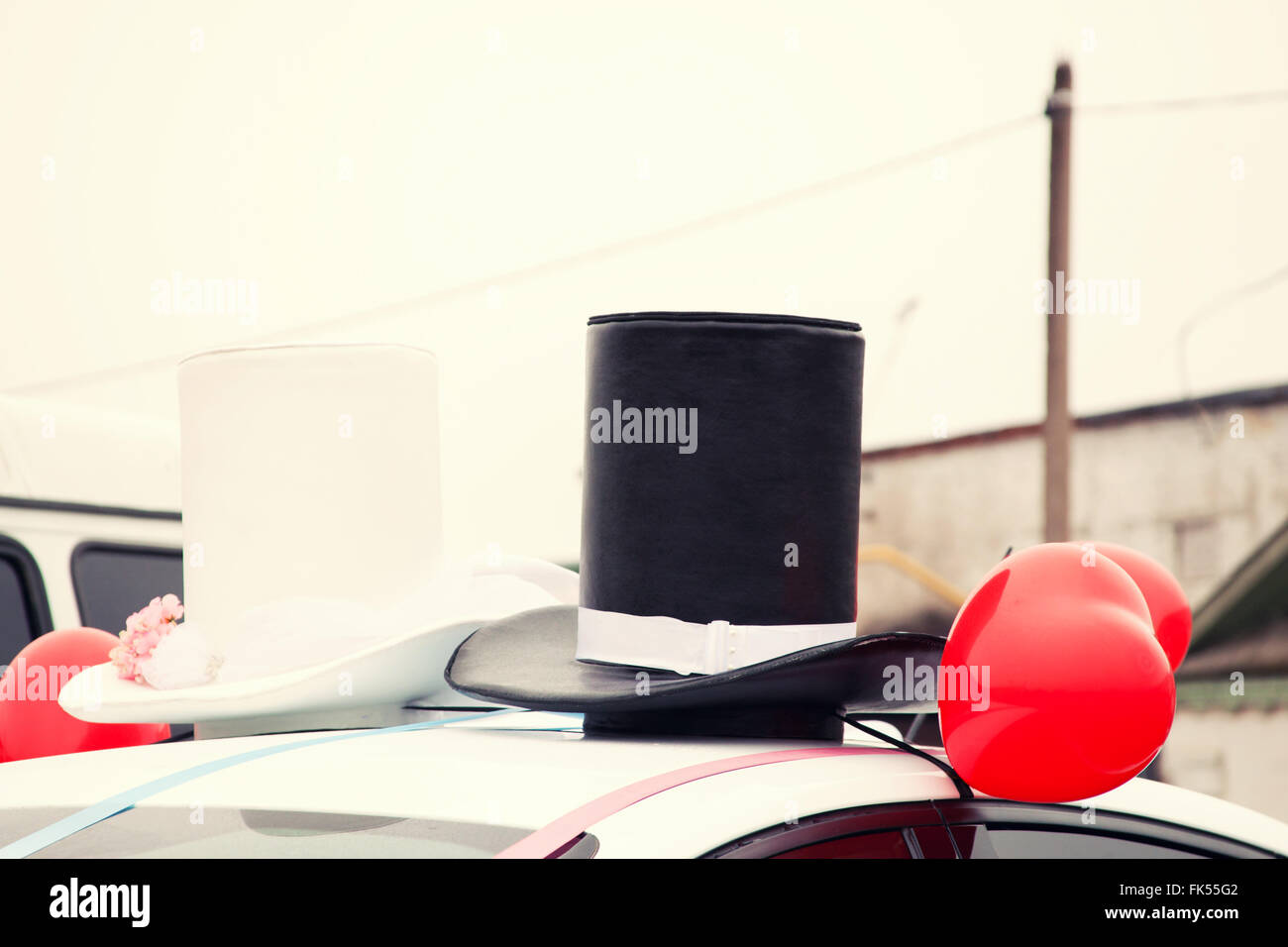 Wedding car decoration with black and white top hats Stock Photo - Alamy