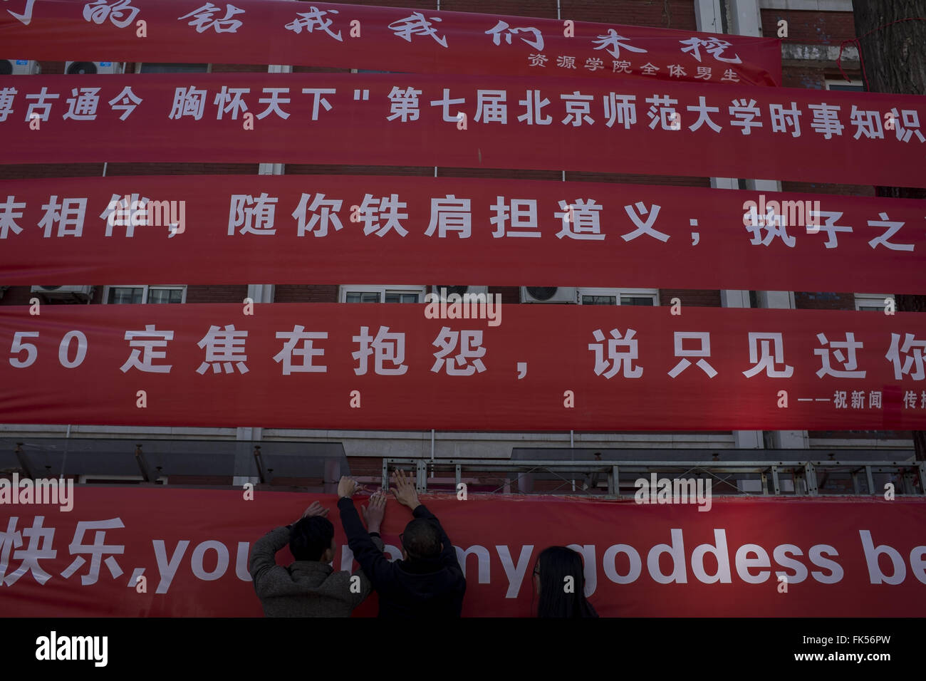 Beijing, China. 7th March, 2016. Many red banners with funny blessings ...