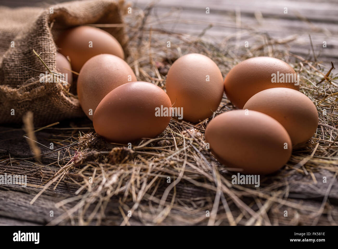 Brown hen eggs on rustic background Stock Photo - Alamy