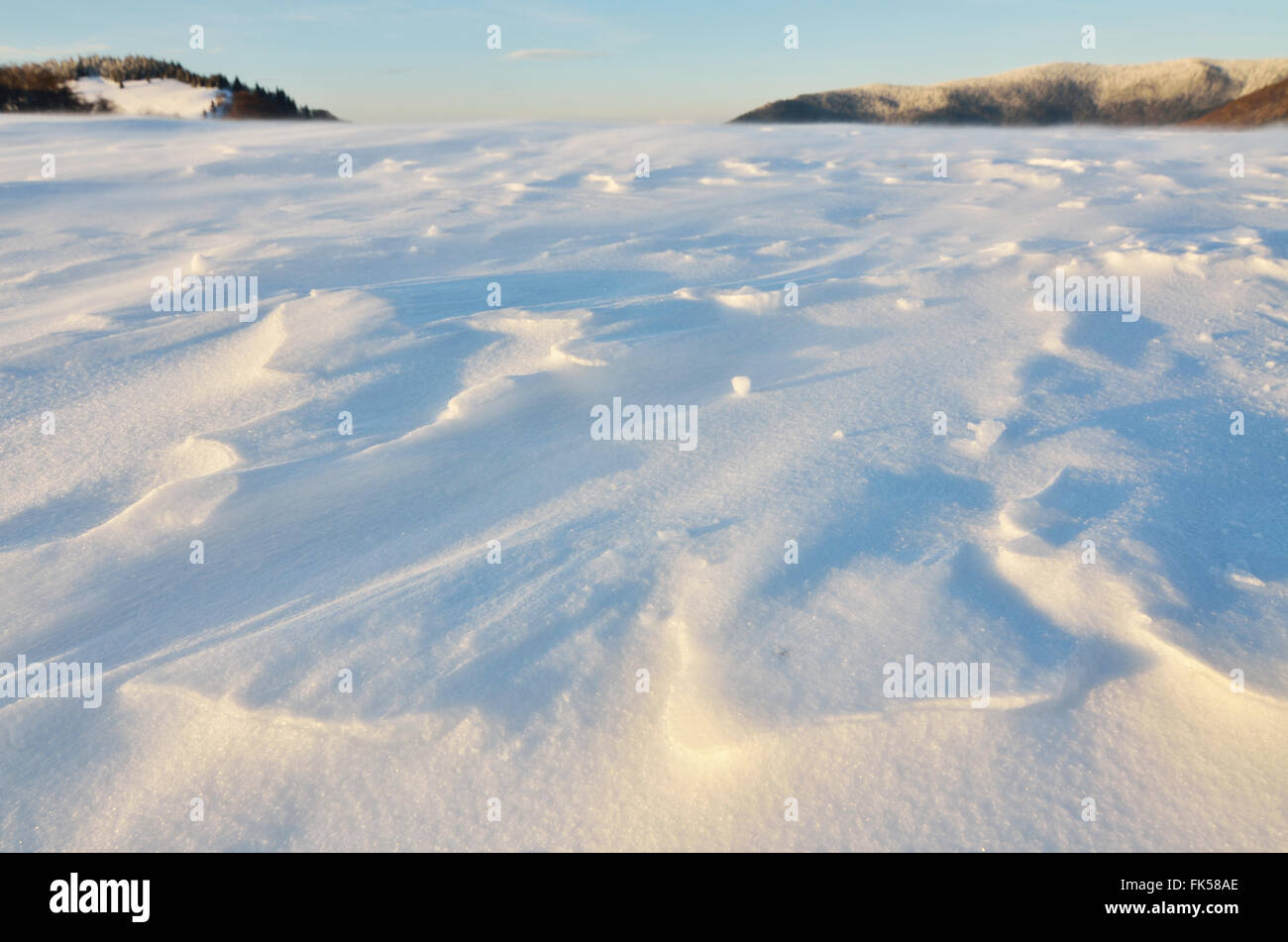 Snowscape close up in the mountains in lights of setting sun Stock ...