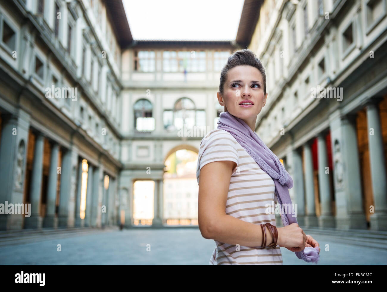 Be inspired by Uffizi Gallery. Young woman tourist enjoying attractions ...